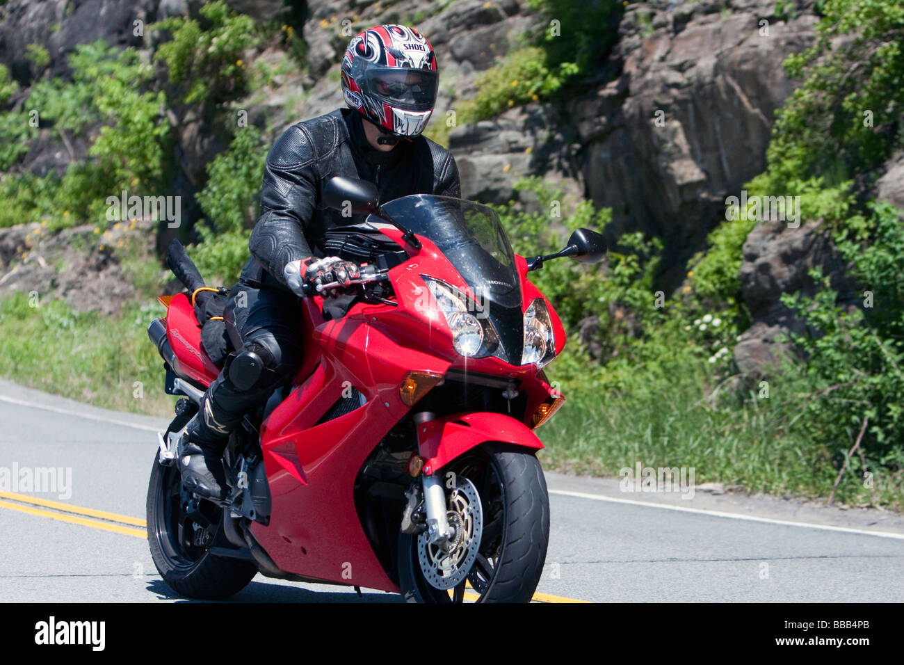 A motorbike motorcycle driving the winding road at Hawks Nest New York ...