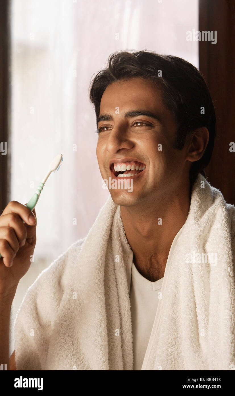 Man with toothbrush Stock Photo - Alamy