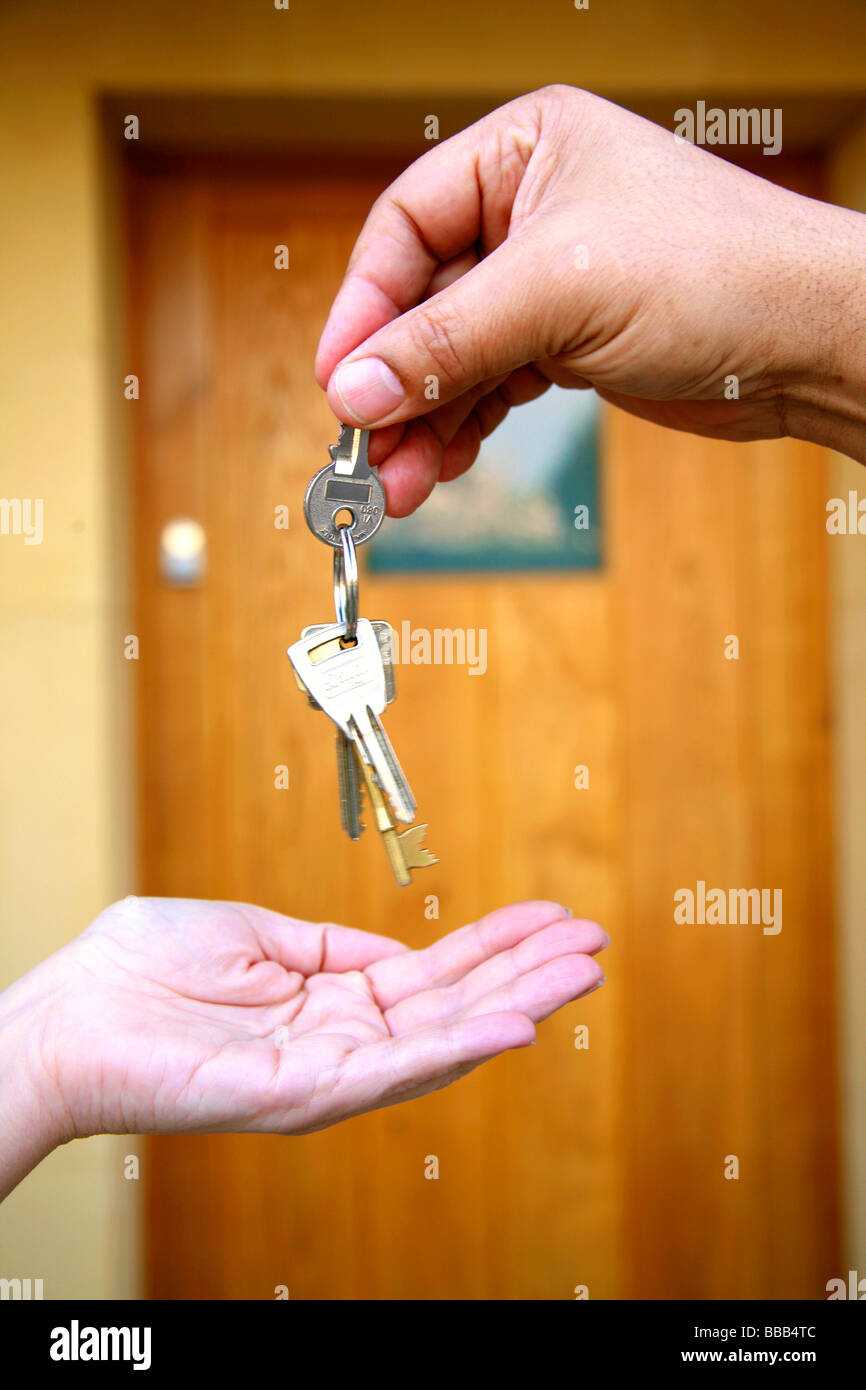 Keys hands front door hi-res stock photography and images - Alamy