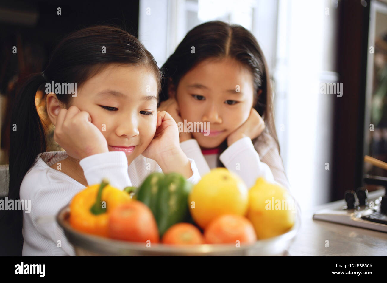 Children staring at a bowl of vegetables Stock Photo - Alamy