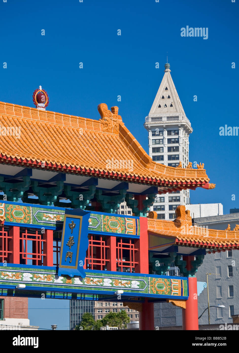 Seattle WA Chinatown Gate with the Smith Tower in the background Stock ...