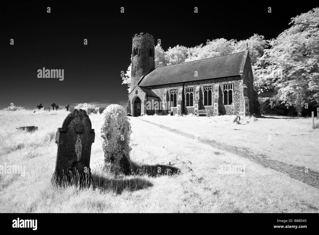 The round towered church and graveyard at Bessingham "North Norfolk" UK ...