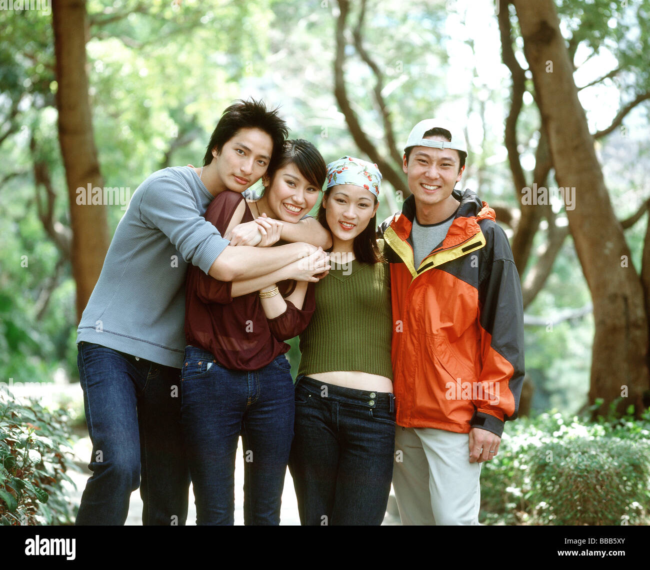 Group of friends hugging Stock Photo - Alamy