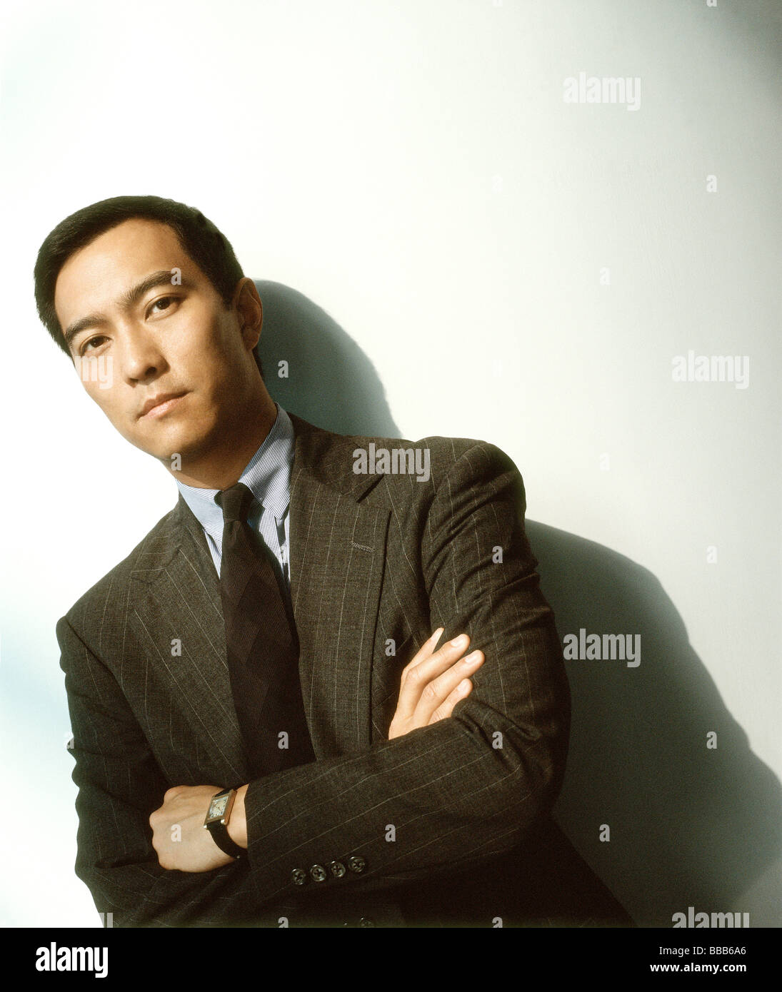 Male executive against white background, portrait Stock Photo - Alamy