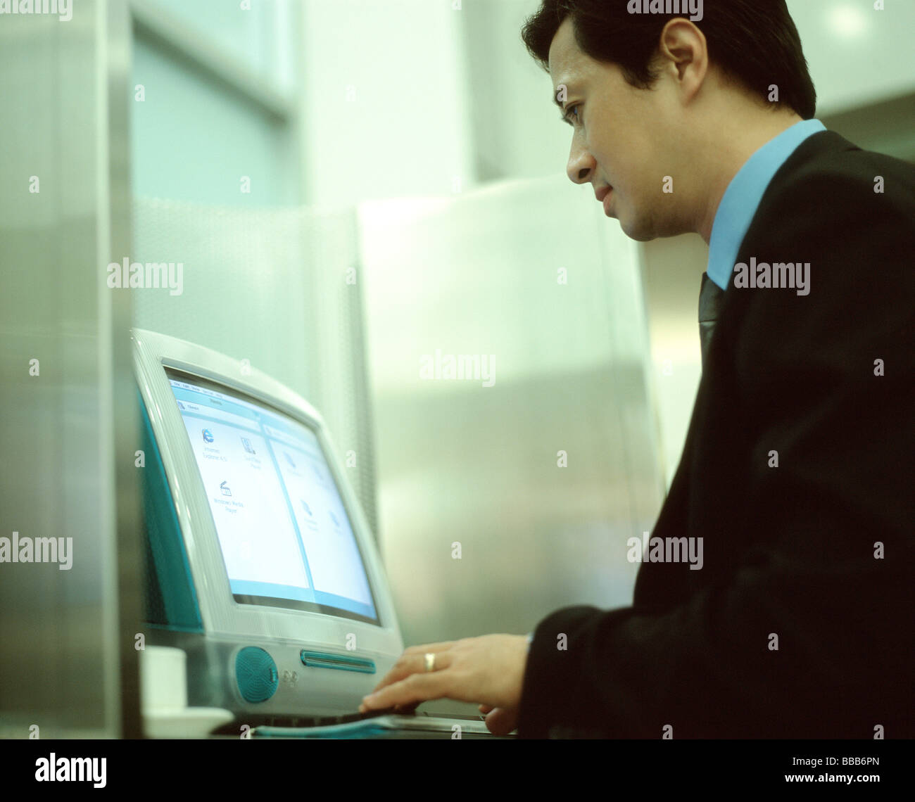 Male executive on computer Stock Photo - Alamy