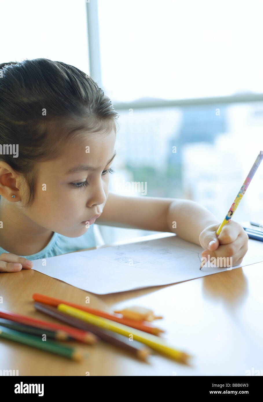 Young girl drawing with pencil Stock Photo - Alamy