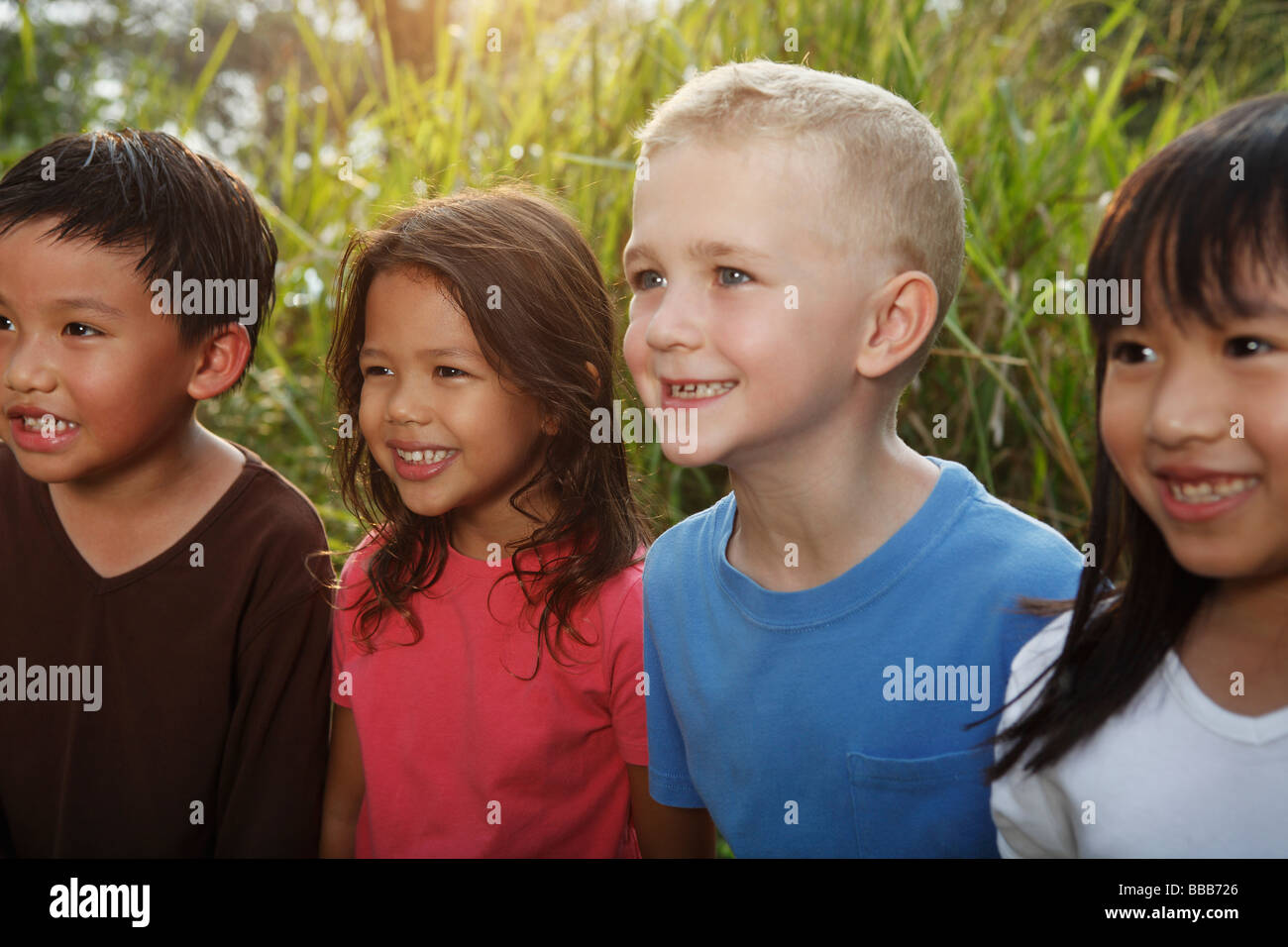 Close-up of four children smiling Stock Photo - Alamy