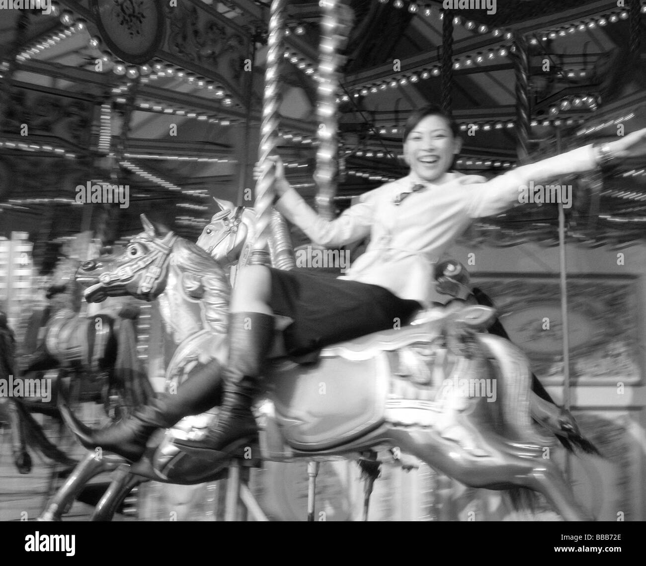 Woman on carousel Stock Photo - Alamy