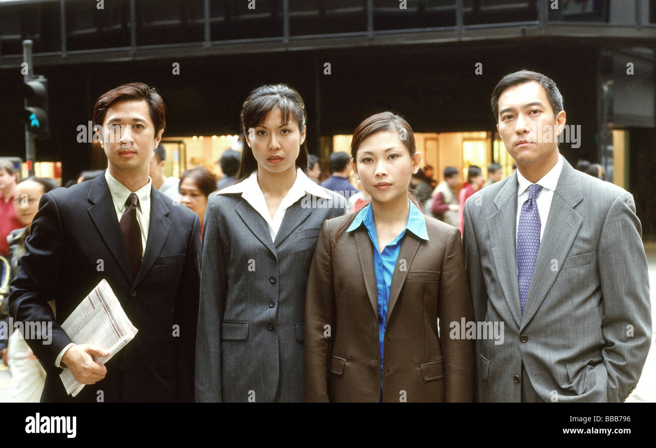 Executives standing in a row, portrait Stock Photo - Alamy