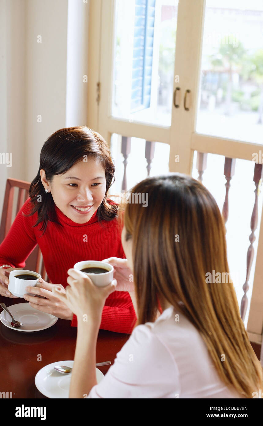 Women having coffee in cafe Stock Photo - Alamy