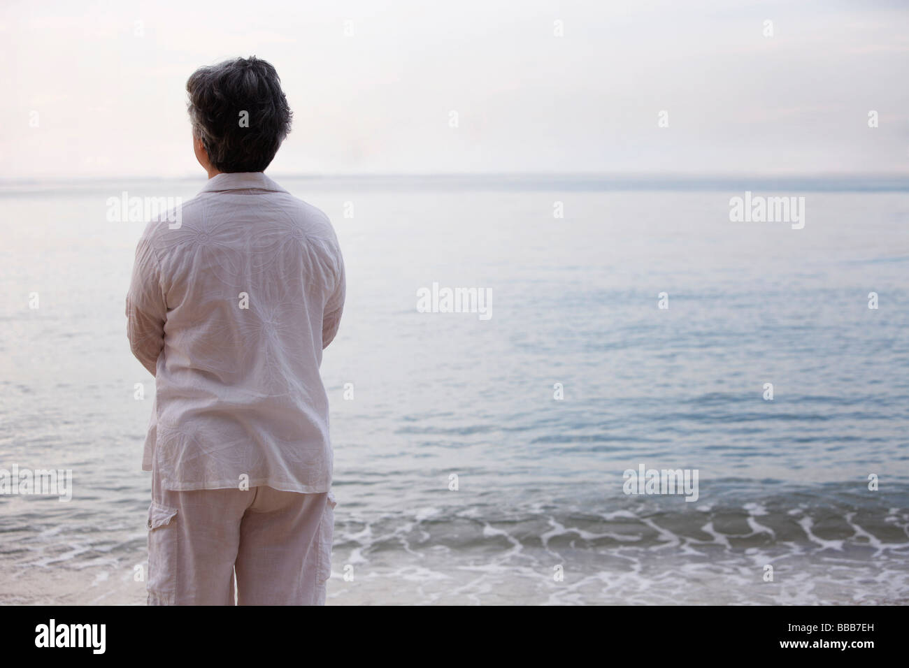 Women looking at ocean Stock Photo - Alamy