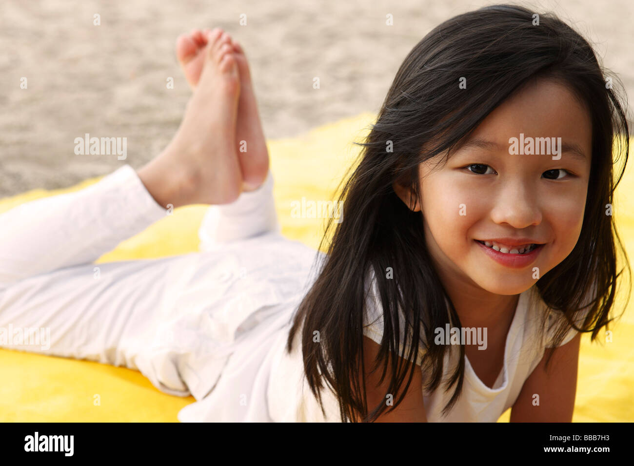 Little Girl Lying On Stomach at Dara Patao blog