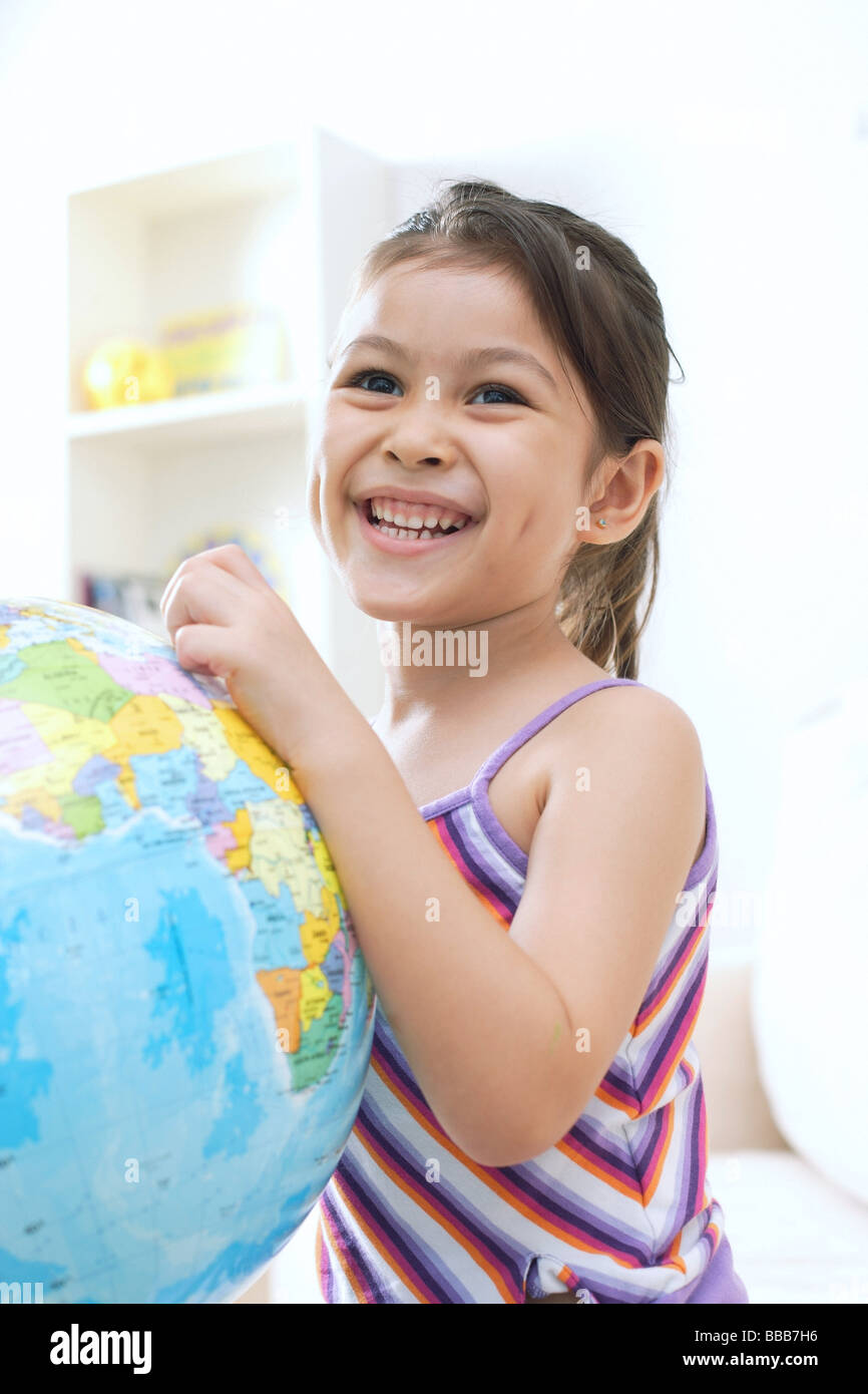Children education touching globe hi-res stock photography and images ...