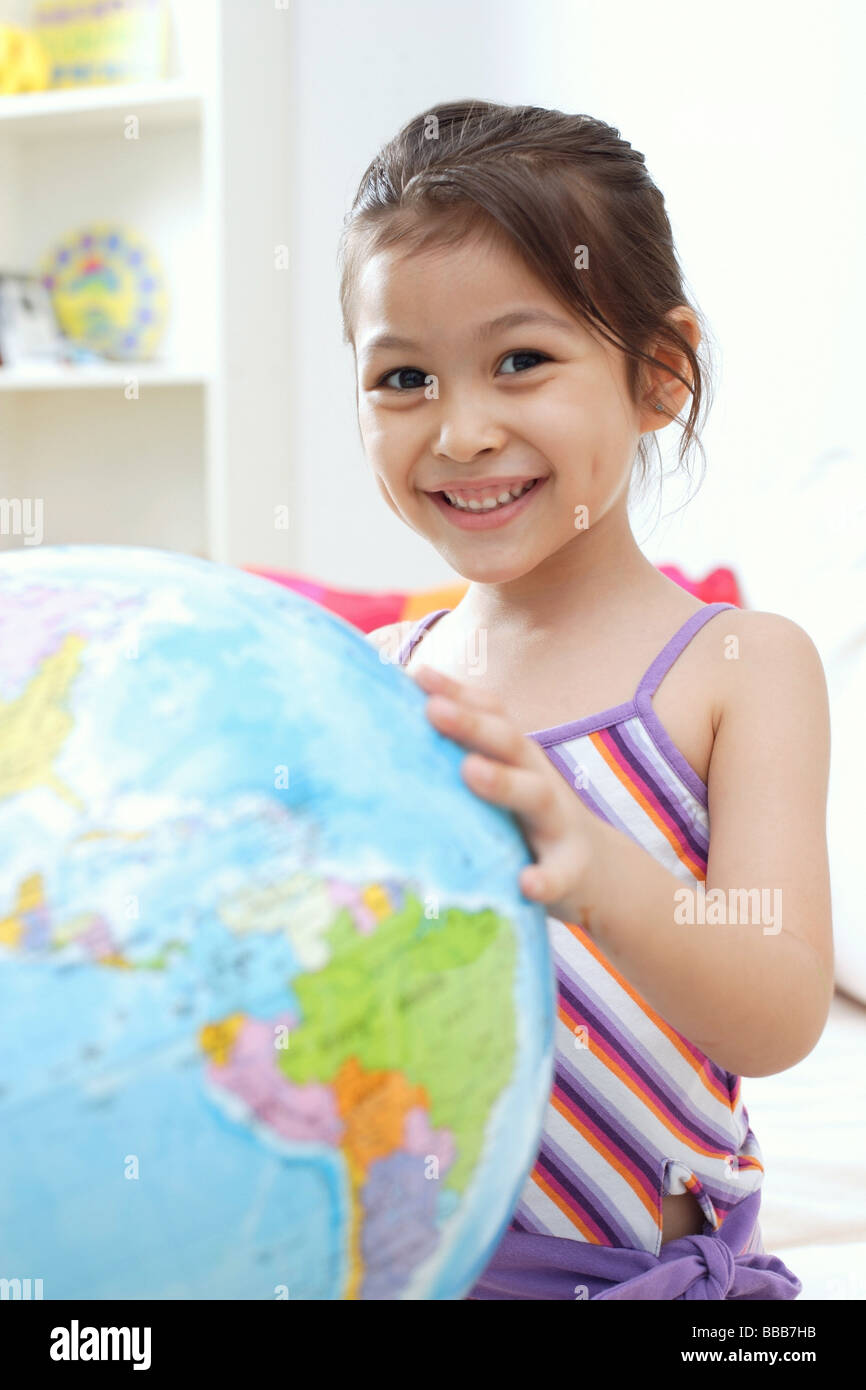 Children education touching globe hi-res stock photography and images ...