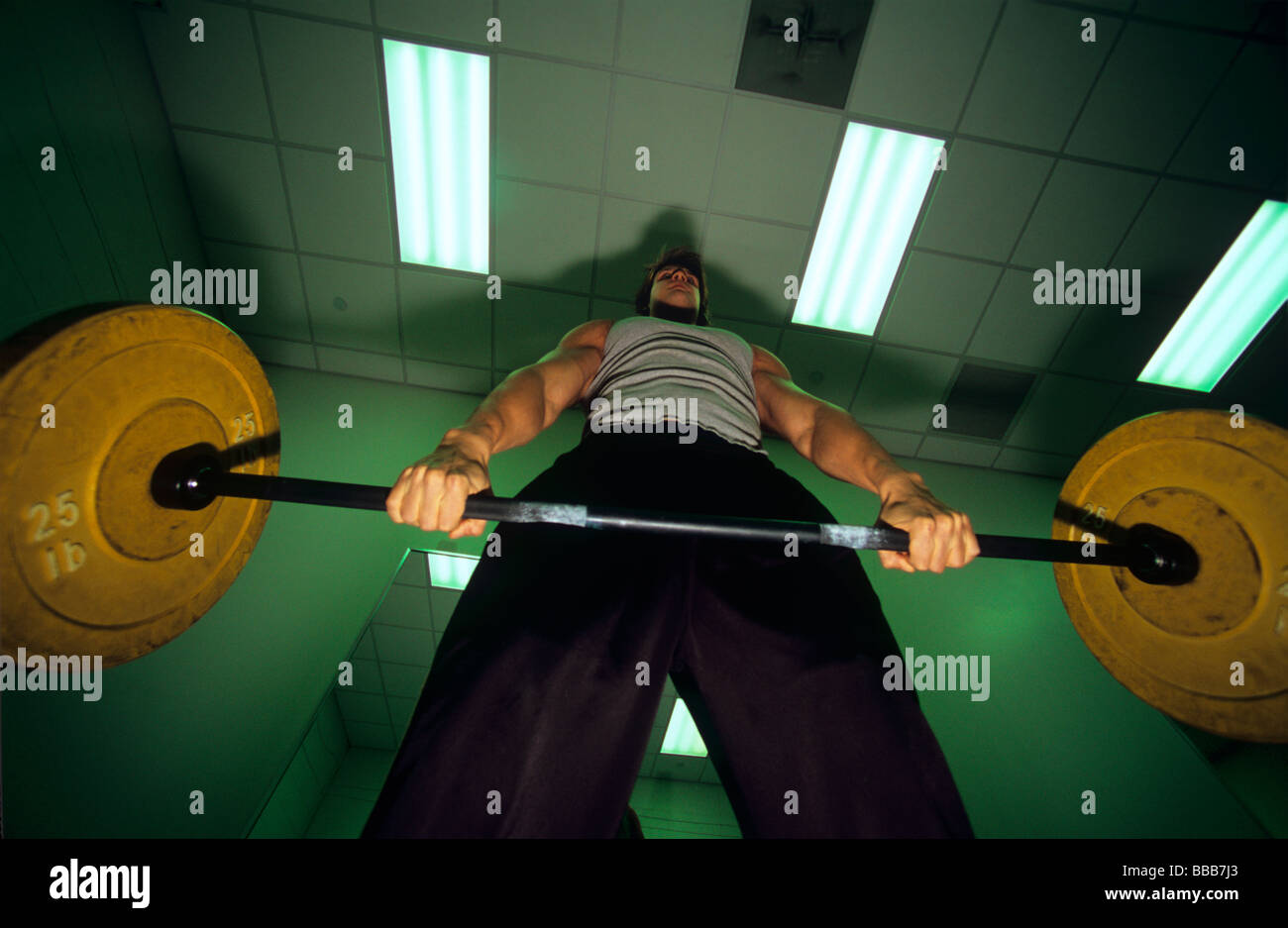 Body builder exercises vigorously Stock Photo - Alamy