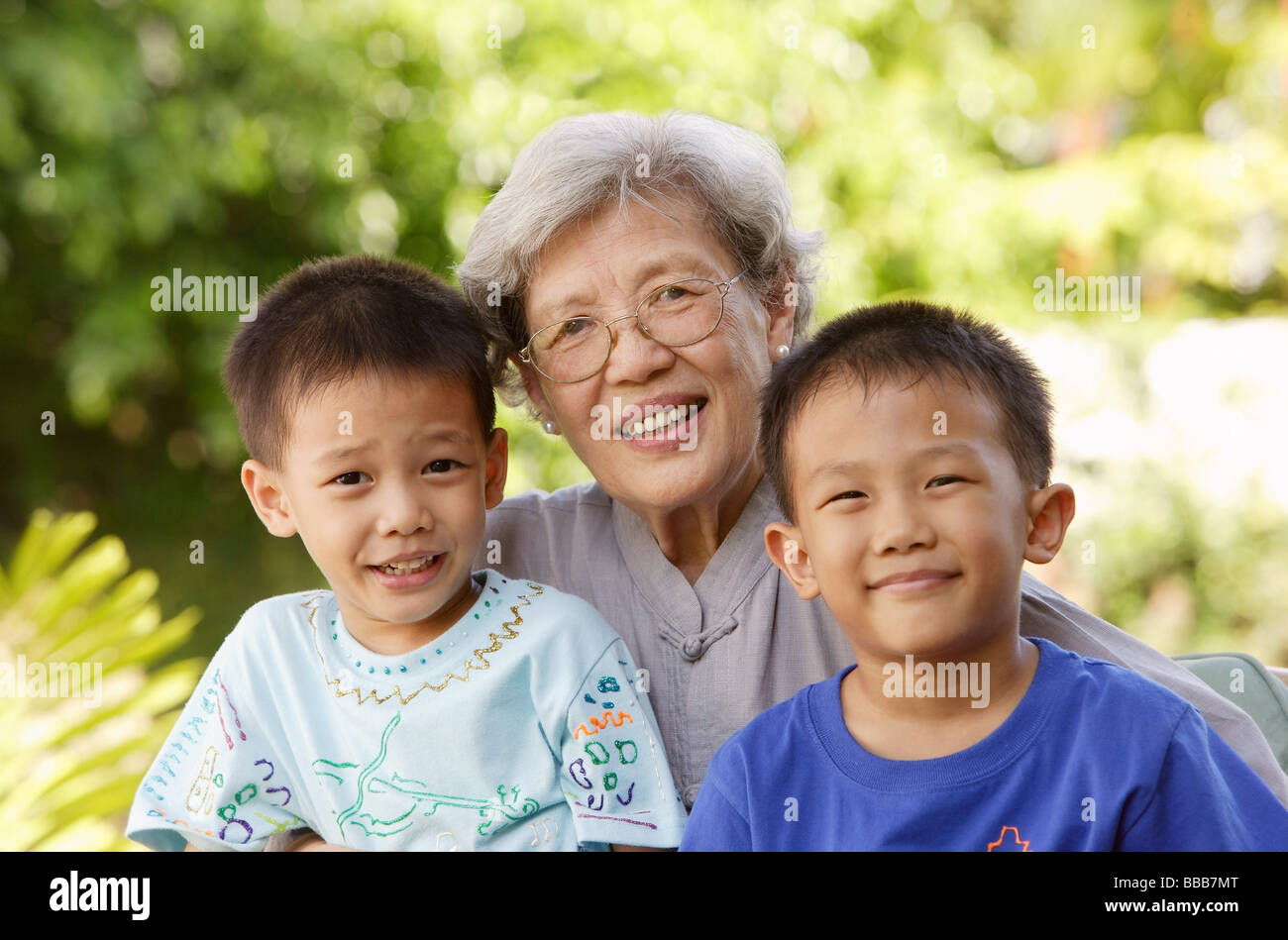 Grandmother with two grandsons Stock Photo - Alamy