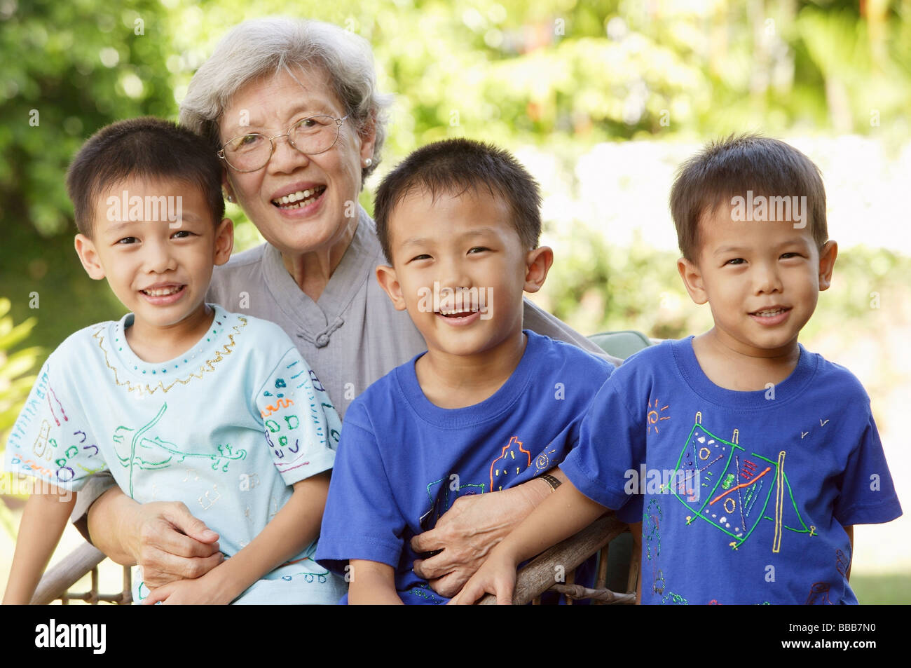 Grandmother with three grandsons Stock Photo - Alamy