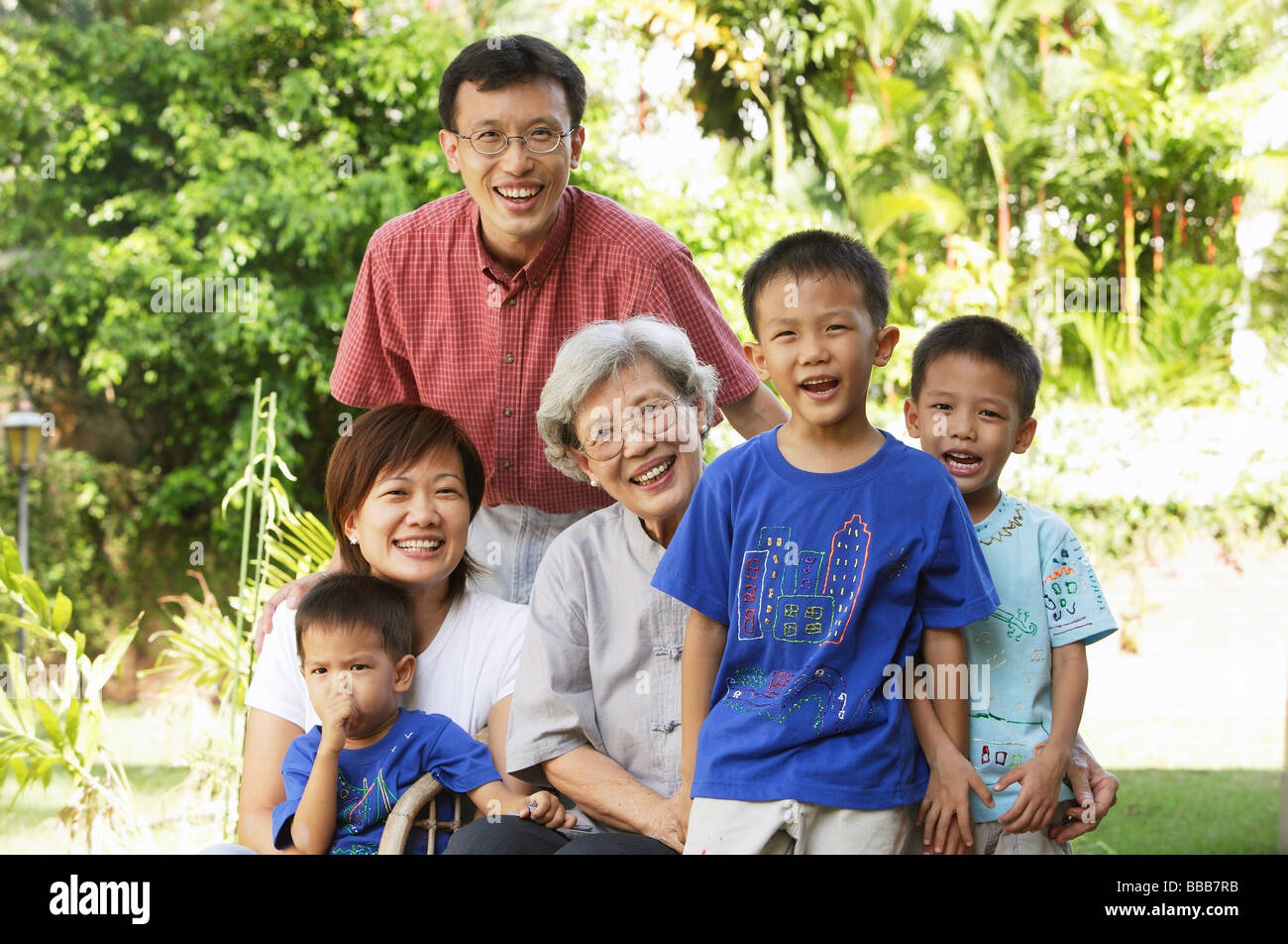 Three generation family, smiling at camera Stock Photo - Alamy