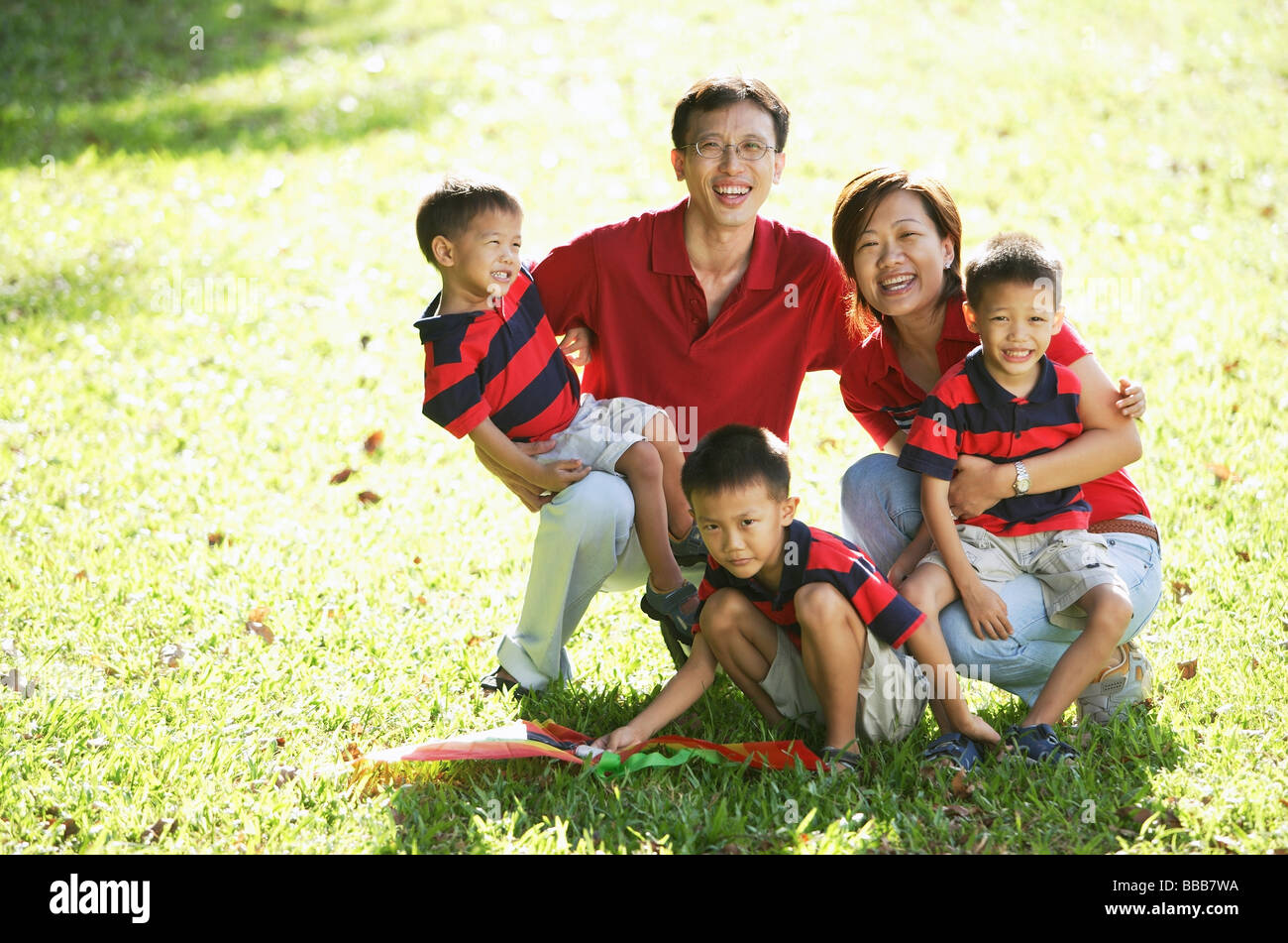 Family with three boys on field, portrait Stock Photo - Alamy