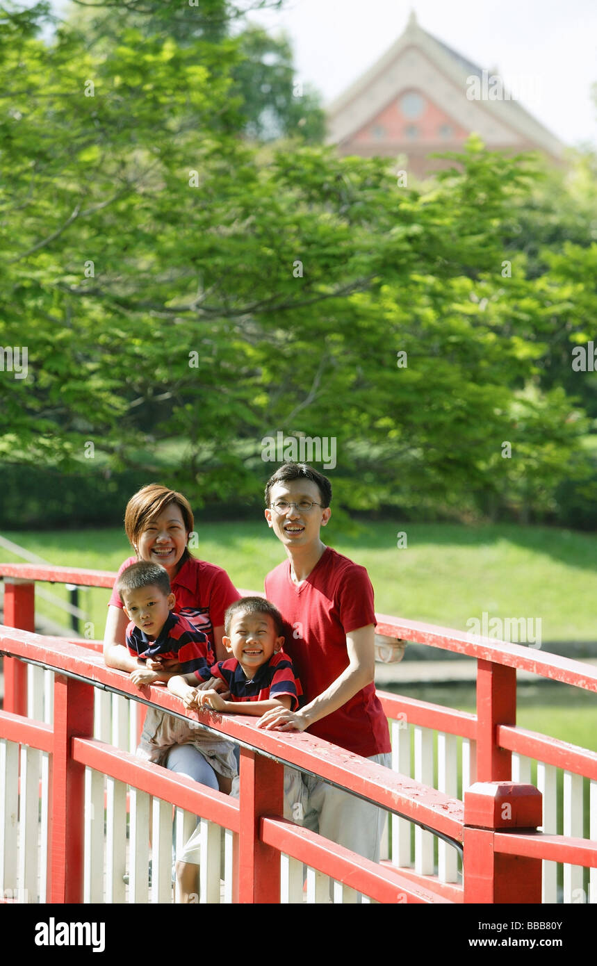 Family with two boys on bridge Stock Photo - Alamy