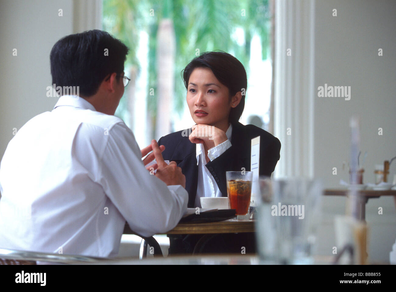 Two executives talking in cafe Stock Photo - Alamy