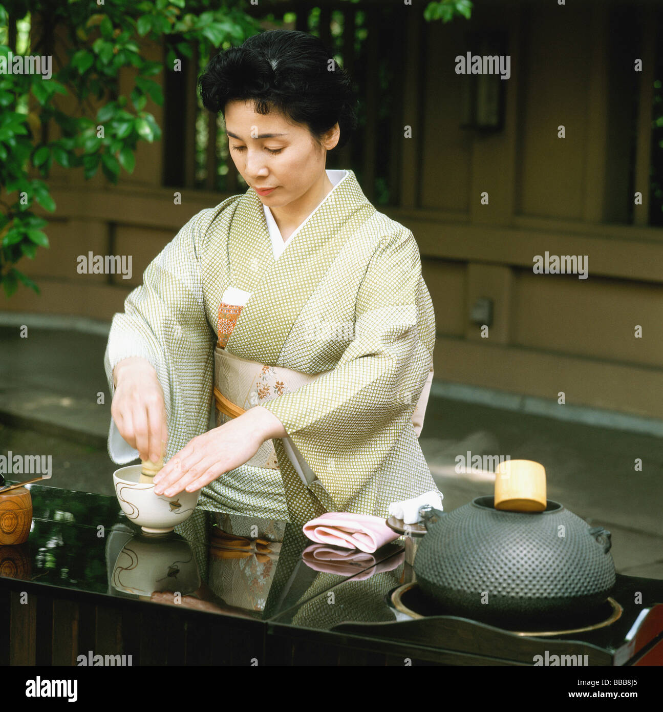 Japan, Woman in kimono performing outdoor tea ceremony Stock Photo - Alamy