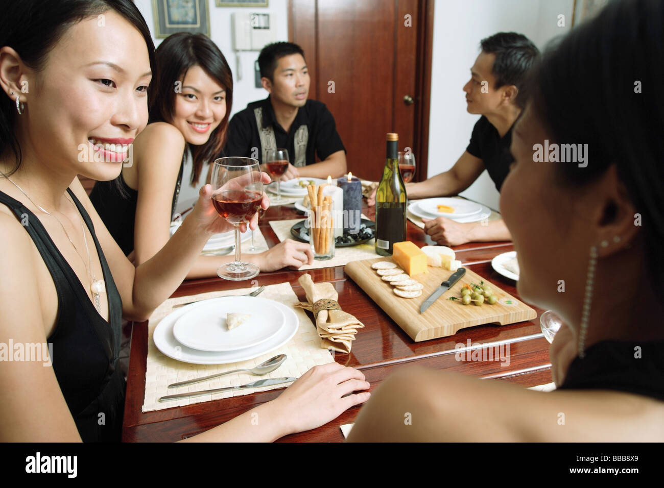 Adults having dinner party, over the shoulder view Stock Photo - Alamy