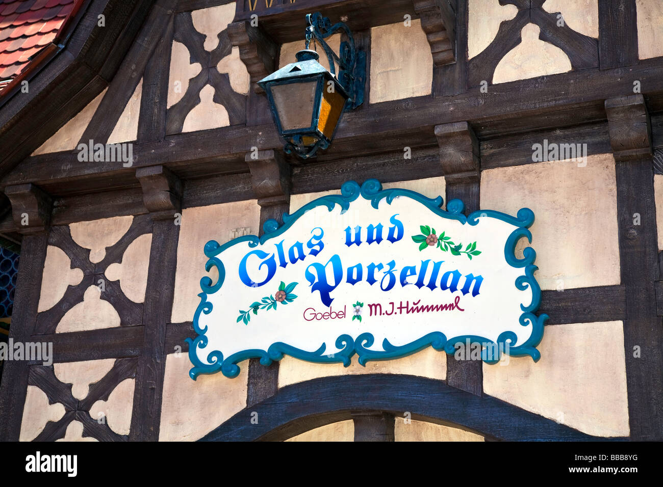 German Bavarian type store display sign at market or village square ...