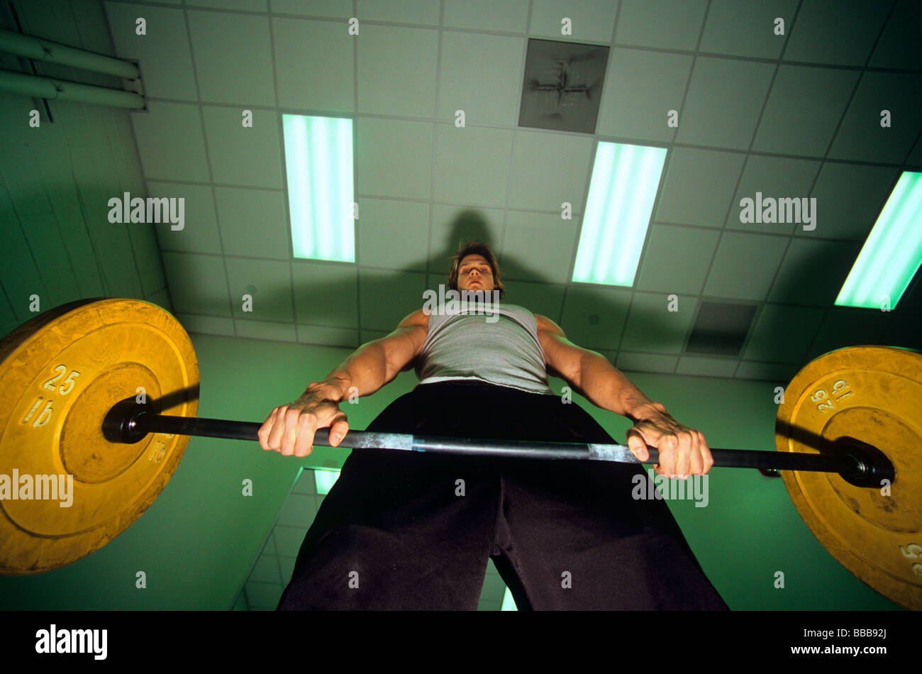 Body builder exercises vigorously Stock Photo - Alamy