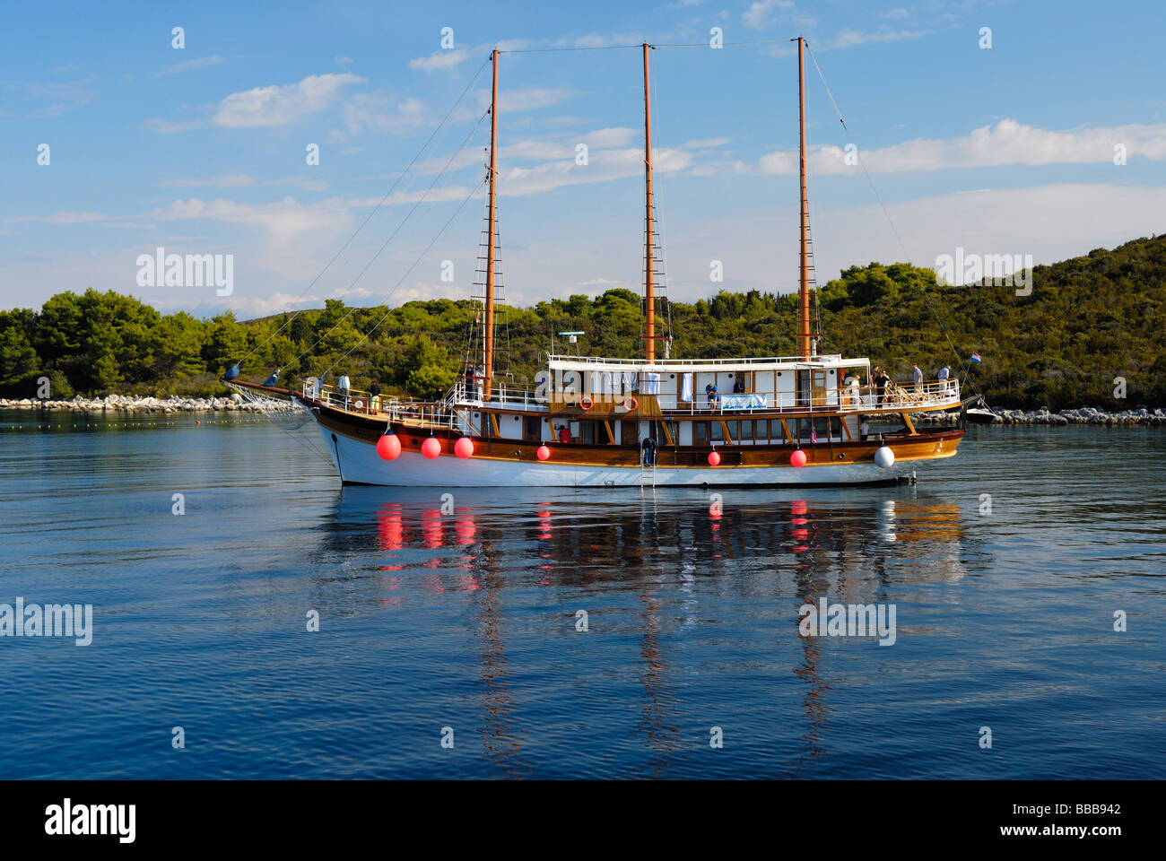 Charter boat at anchor in secluded bay in one of the small islands in ...