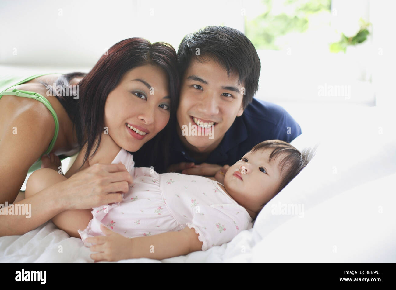 Family with one child, portrait Stock Photo - Alamy