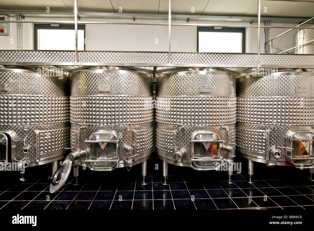 Barrels of wine in stainless steel Winery Maison Anselment to ...