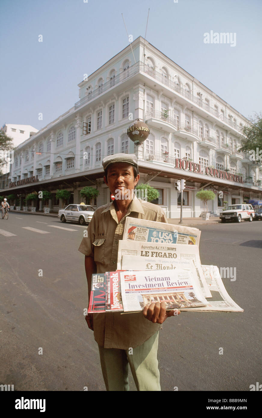 Vietnam, Saigon, newspaper vendor outside Hotel Continental Stock Photo ...