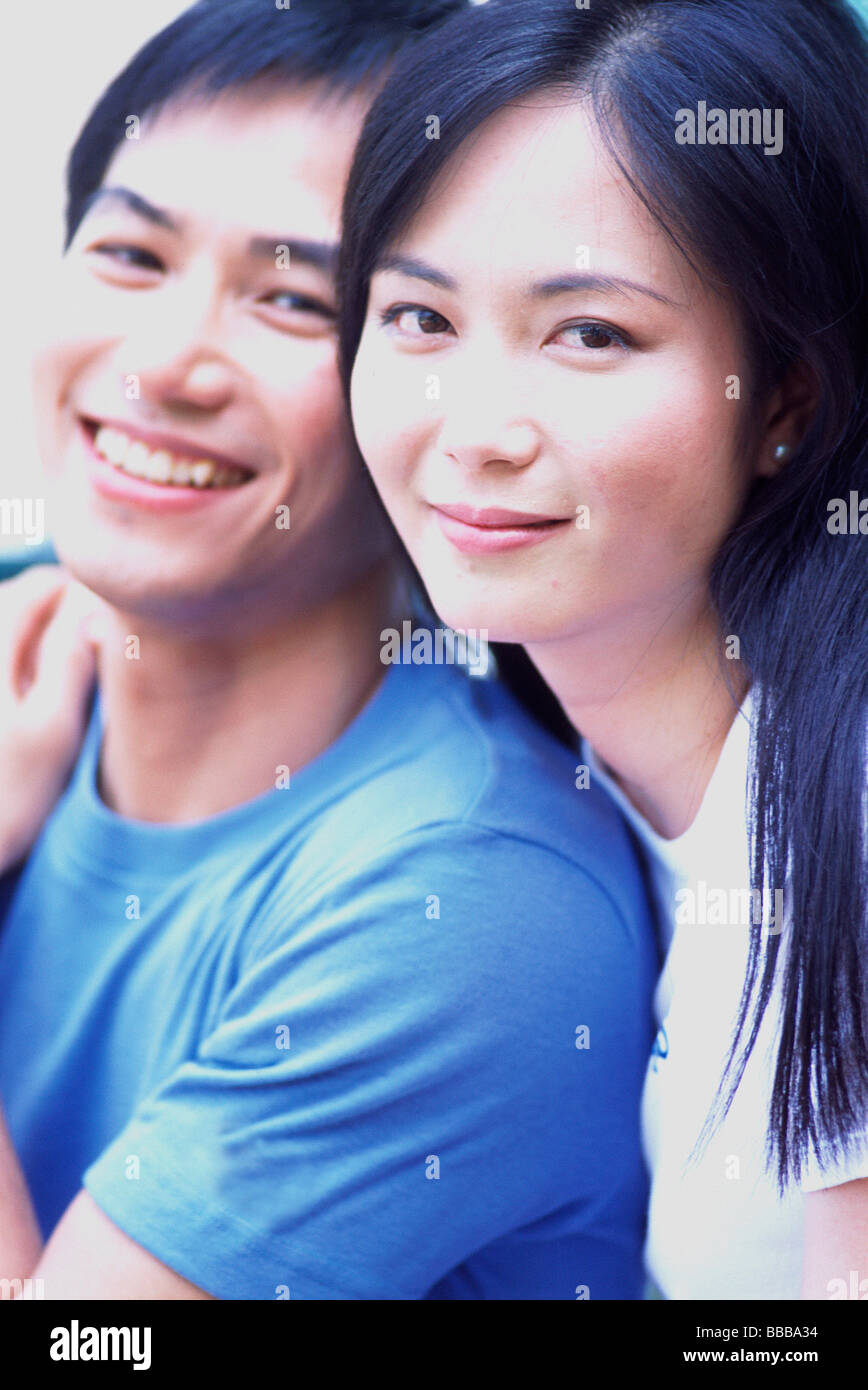 Couple with arm around each other, portrait Stock Photo - Alamy