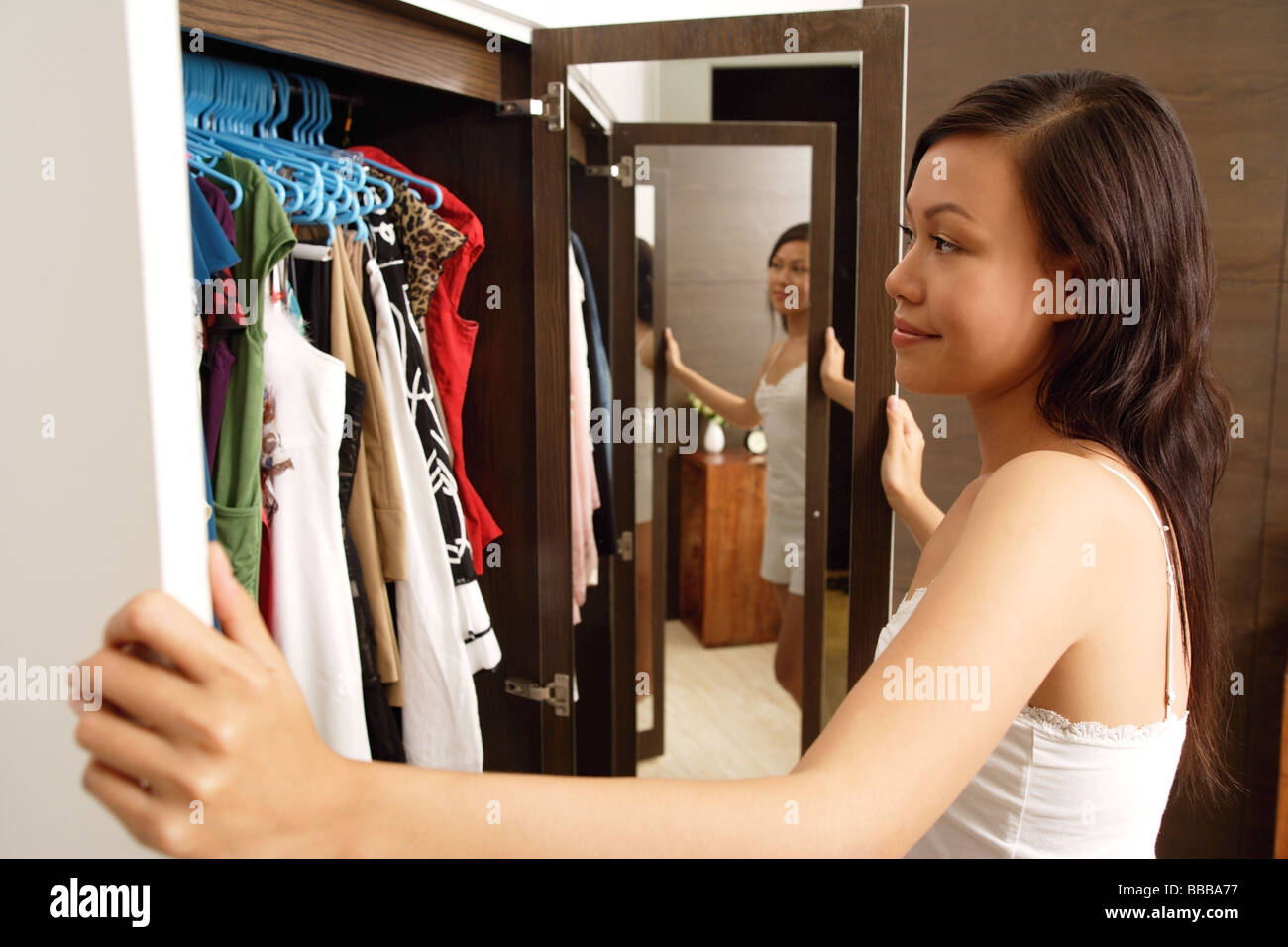 Woman getting dressed wardrobe hi-res stock photography and images - Alamy