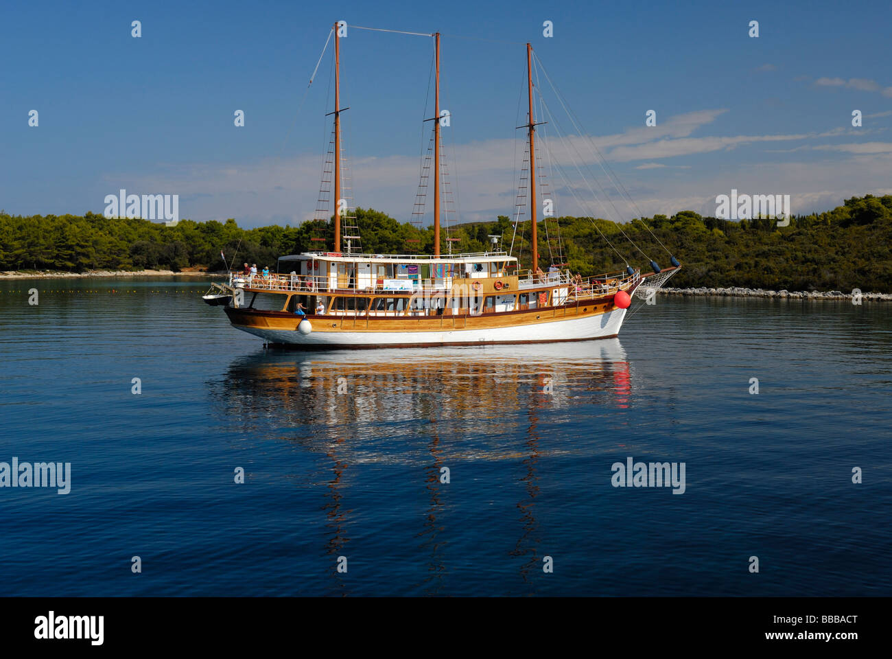 Charter boat at anchor in secluded bay in one of the small islands in ...