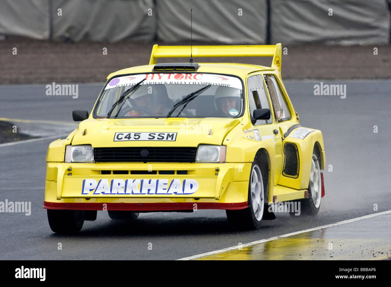 Yellow Metro 6R4 rally car on wet track Stock Photo - Alamy