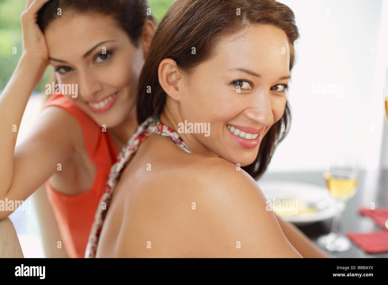 Two women smiling at camera Stock Photo - Alamy