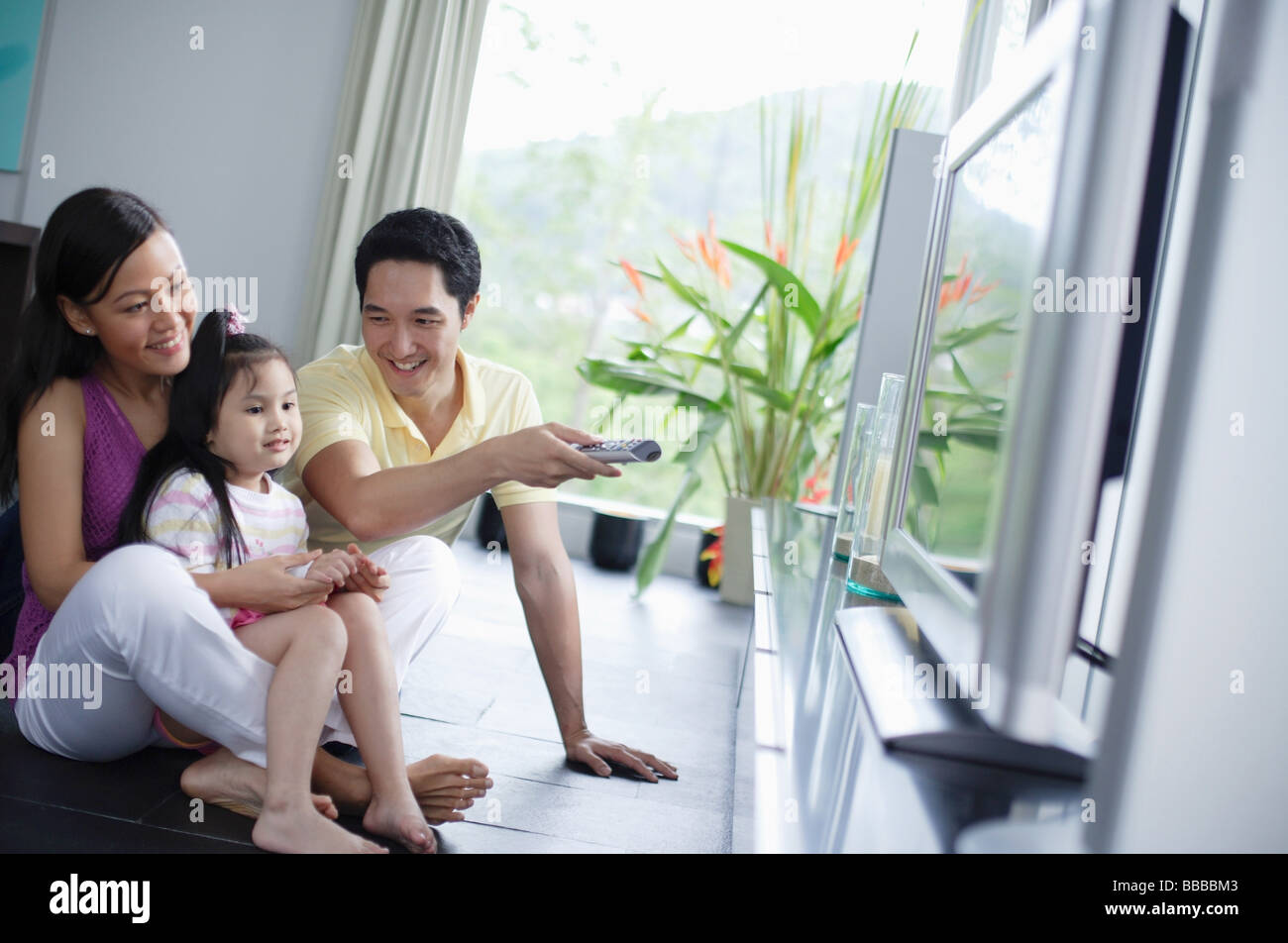 Tv family watching remote hi-res stock photography and images - Alamy
