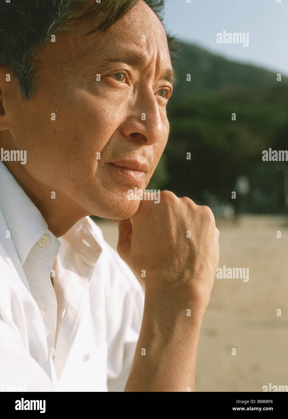 Mature man outdoors, looking off camera Stock Photo - Alamy