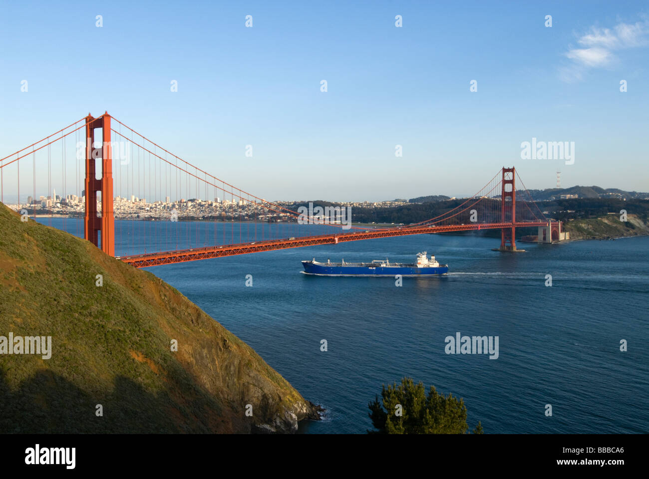 California Container ship passing under Golden Gate Bridge view of ...