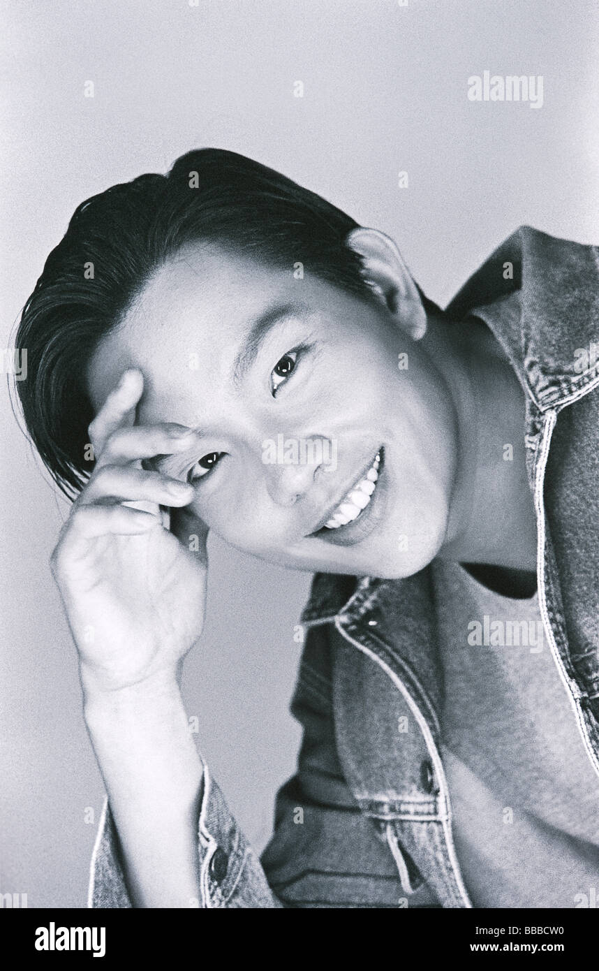 Man smiling, with hand on forehead, portrait ( high grain Stock Photo ...