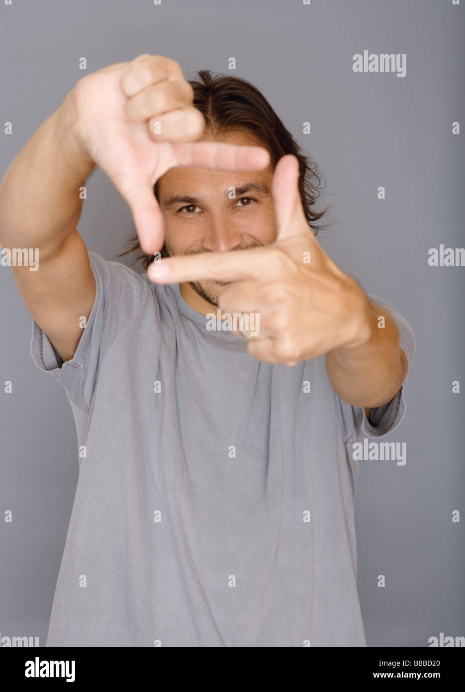Man making square shape with his fingers Stock Photo - Alamy