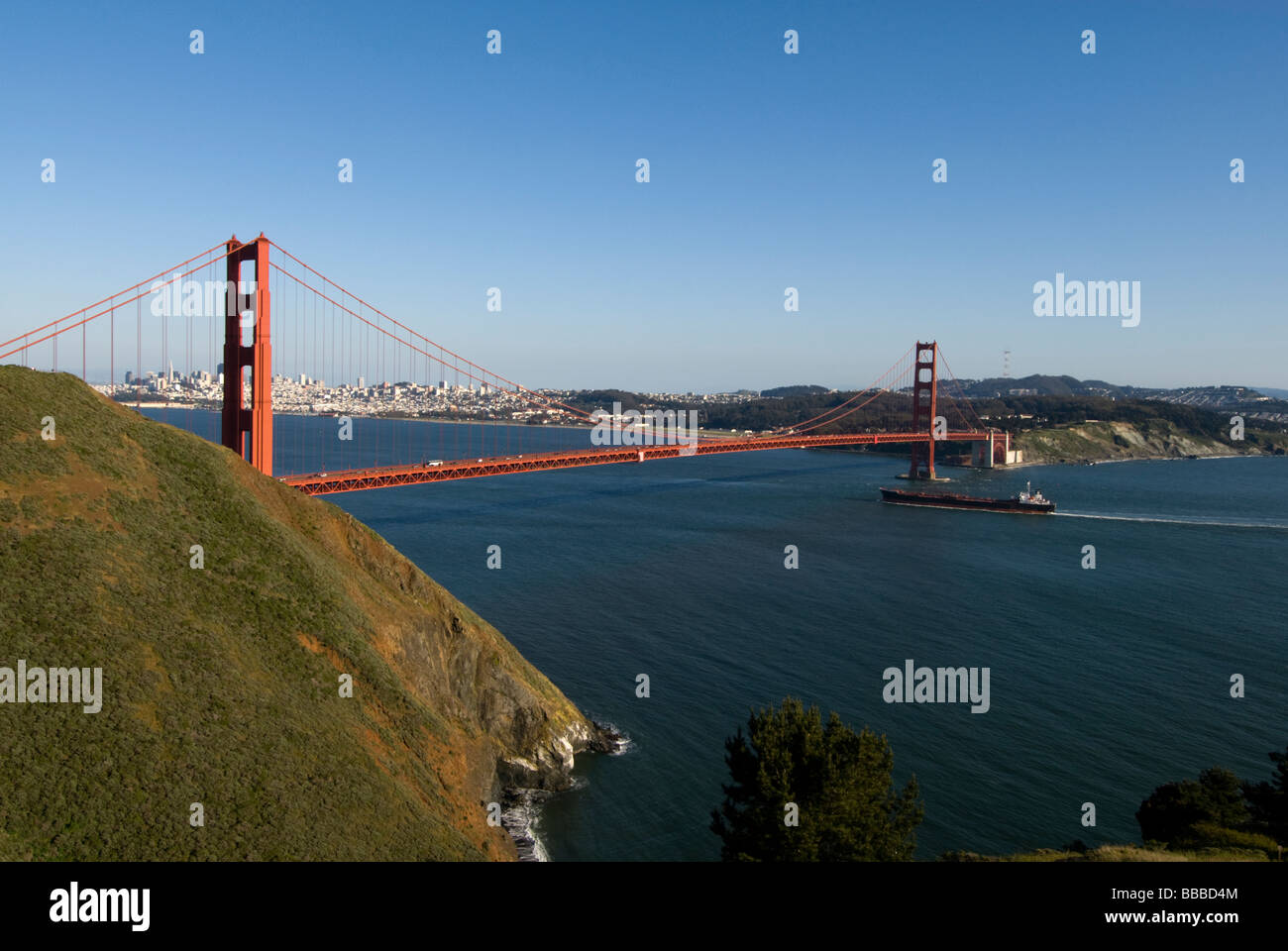 California Container ship passing under Golden Gate Bridge view of ...