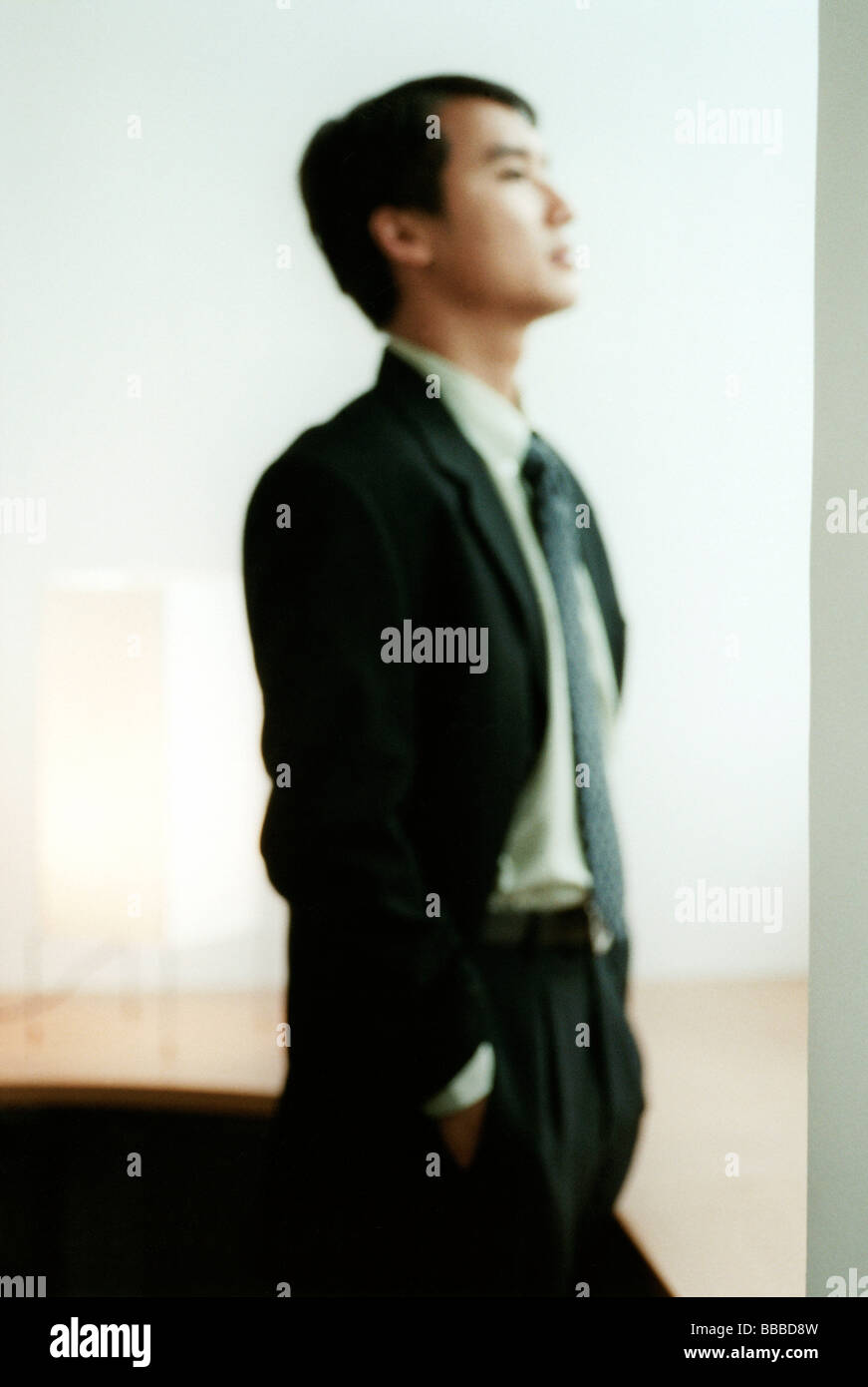 Profile of male executive standing Stock Photo - Alamy