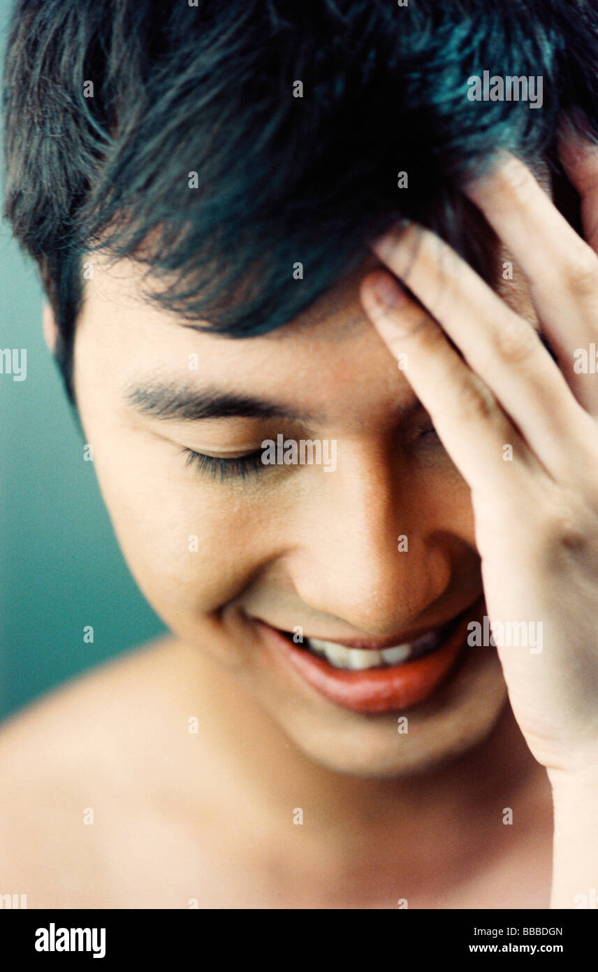 Man with head on hand, eyes closed Stock Photo - Alamy
