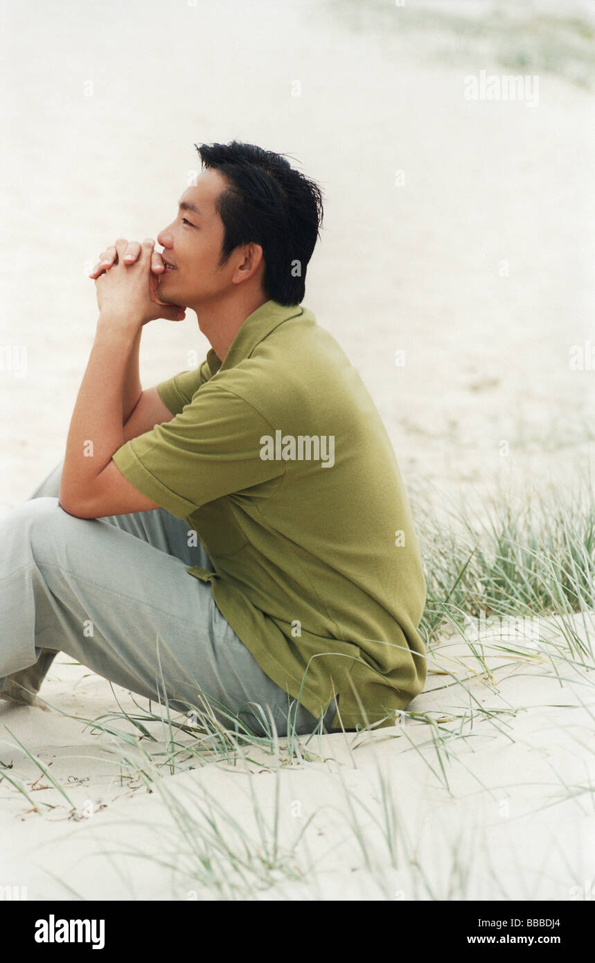 Resting chin on knee hi-res stock photography and images - Alamy