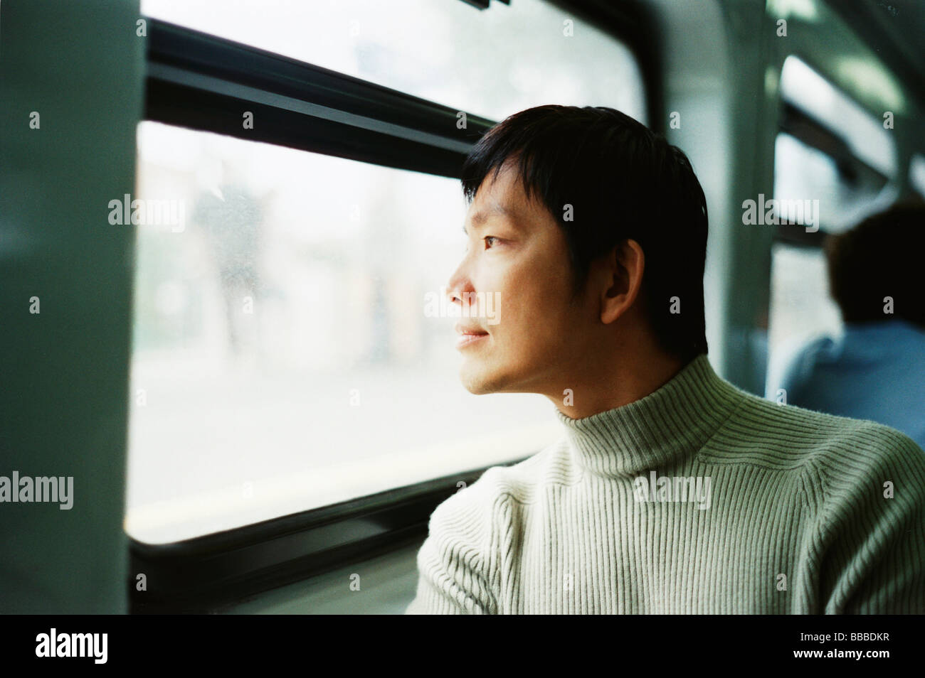 Man looking out window, profile Stock Photo - Alamy