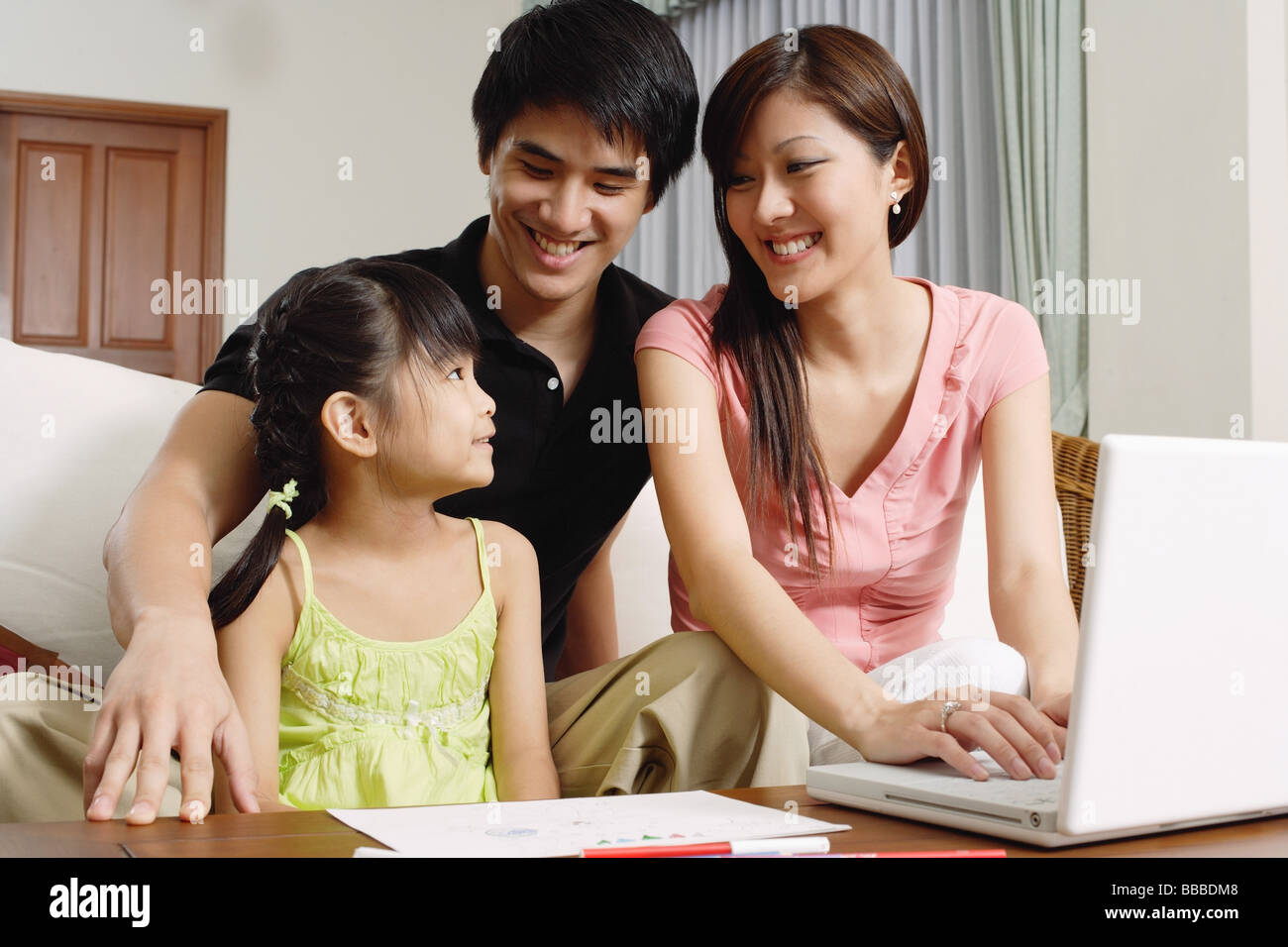 Family with one daughter, at home Stock Photo - Alamy