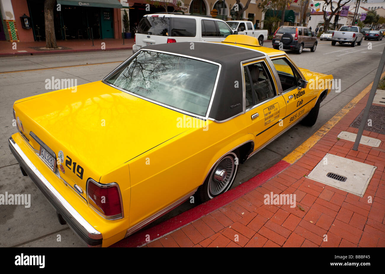 Yellow taxi pulling out, Santa Barbara, California, USA Stock Photo - Alamy